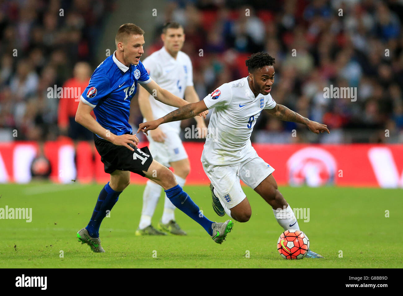 England's Raheem Sterling and Estonia's Karol Mets (left) battle for ...