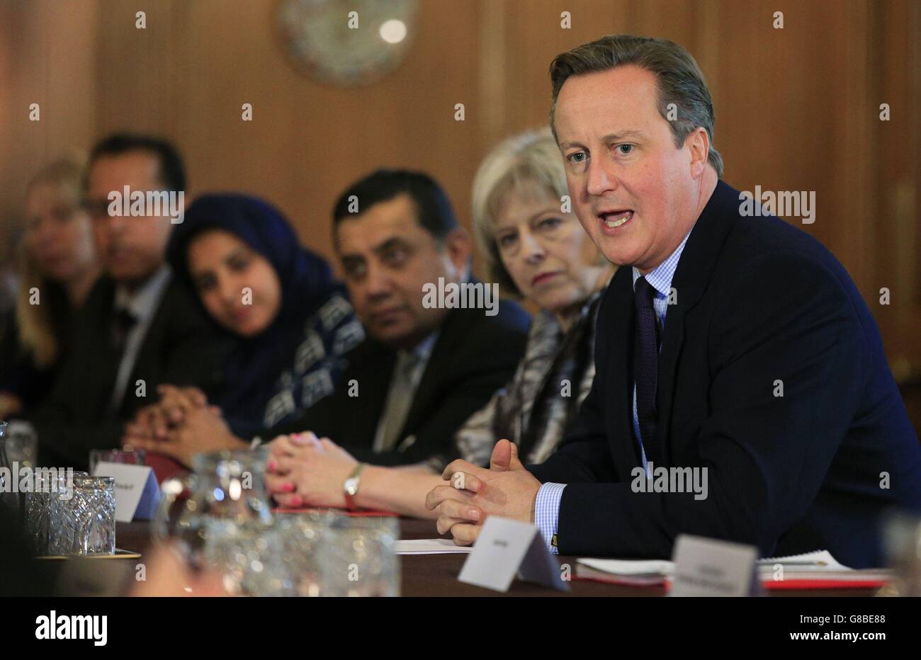 Prime Minister David Cameron (right), alongside Lord Ahmad (third right ...