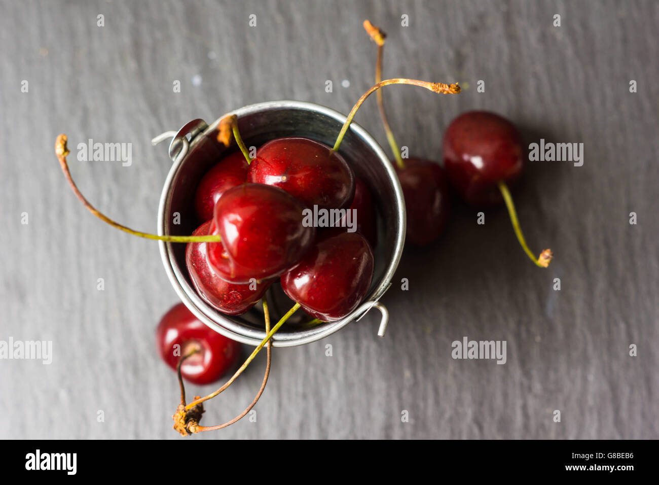 Fresh sour cherries in a metal pot Stock Photo - Alamy