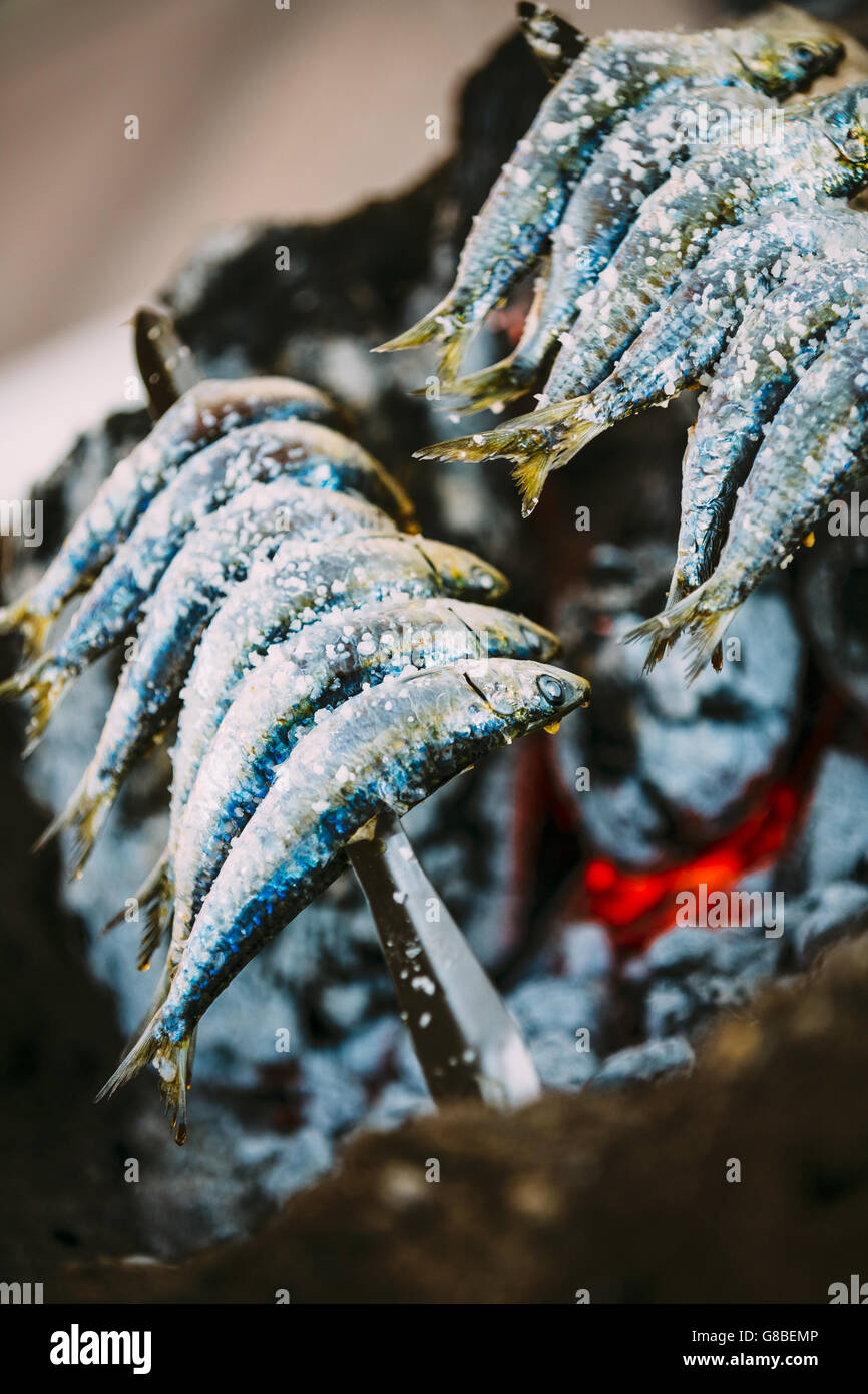 Fish Espetos Preparation. Espetos - Skewer With Sardines In Open Fire ...
