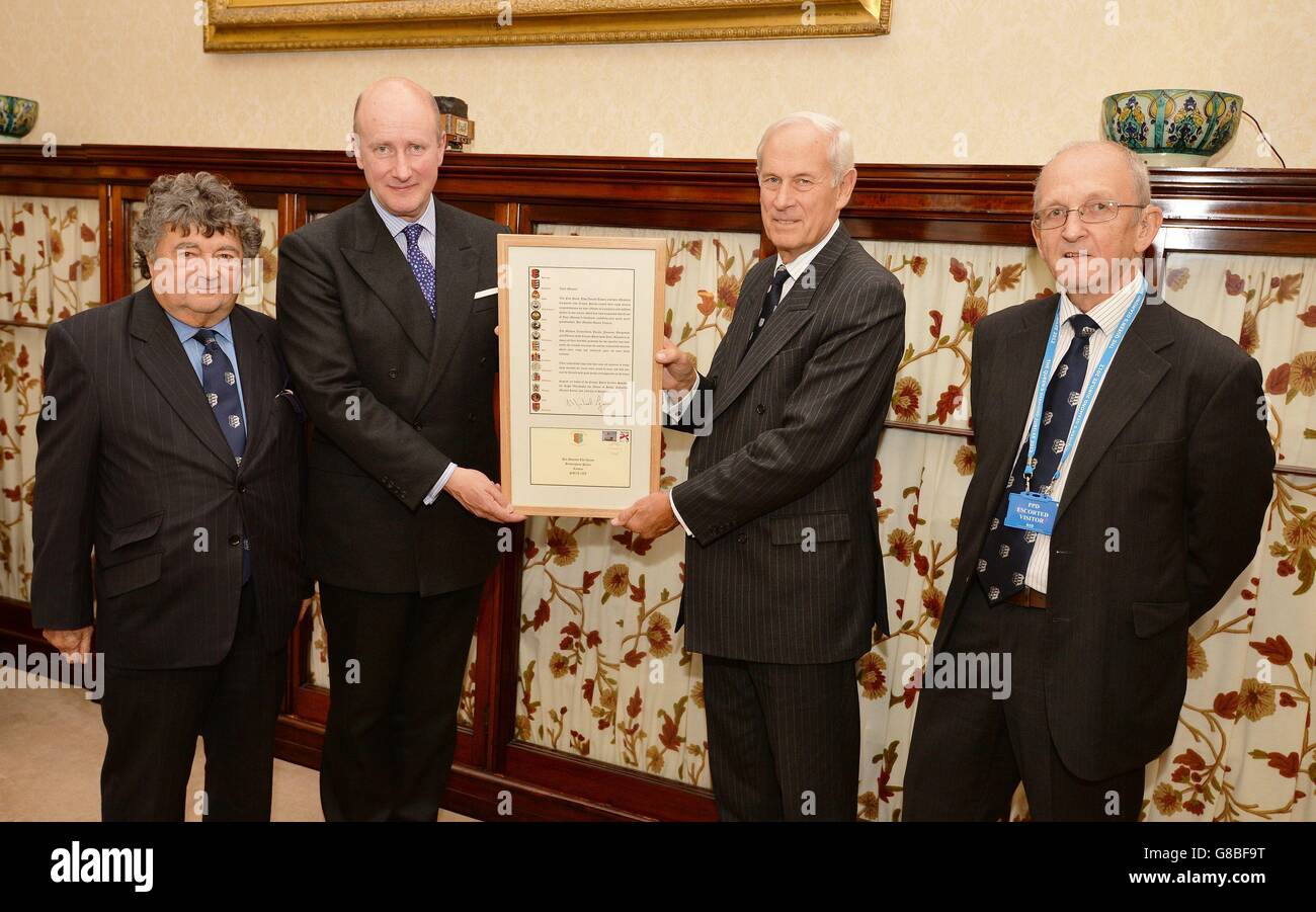 The Queen's private secretary Sir Christopher Geidt (second left) is ...
