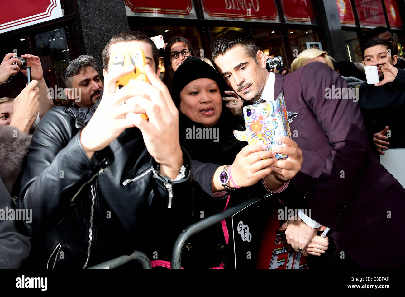 Colin Farrell poses for selfies with fans whilst attending the official ...