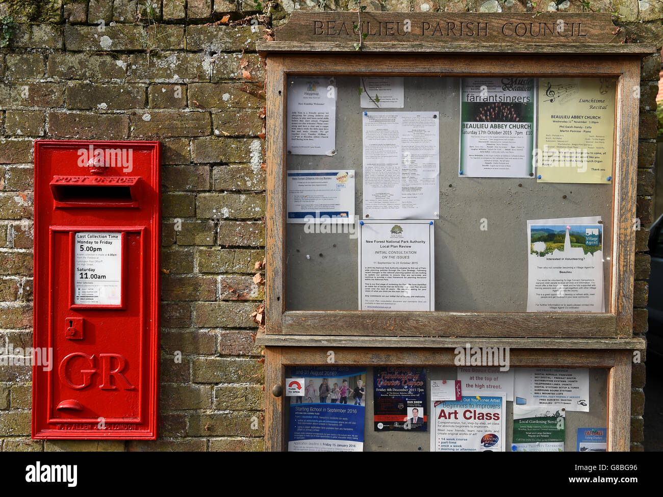 General view of a Post Office Post box next to a notice board for the ...