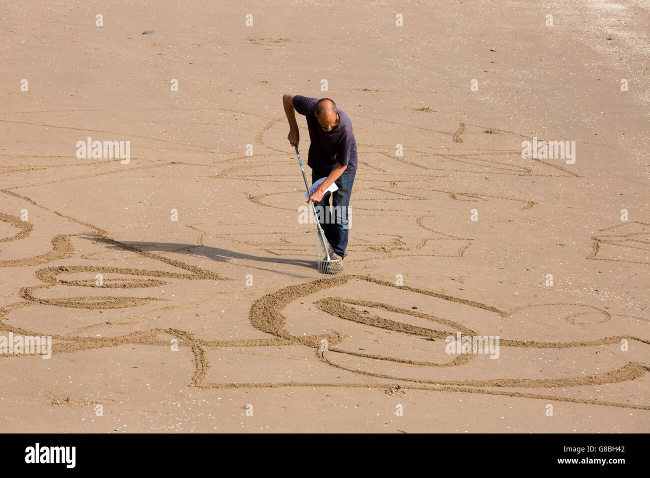 Raking sand hi-res stock photography and images - Alamy