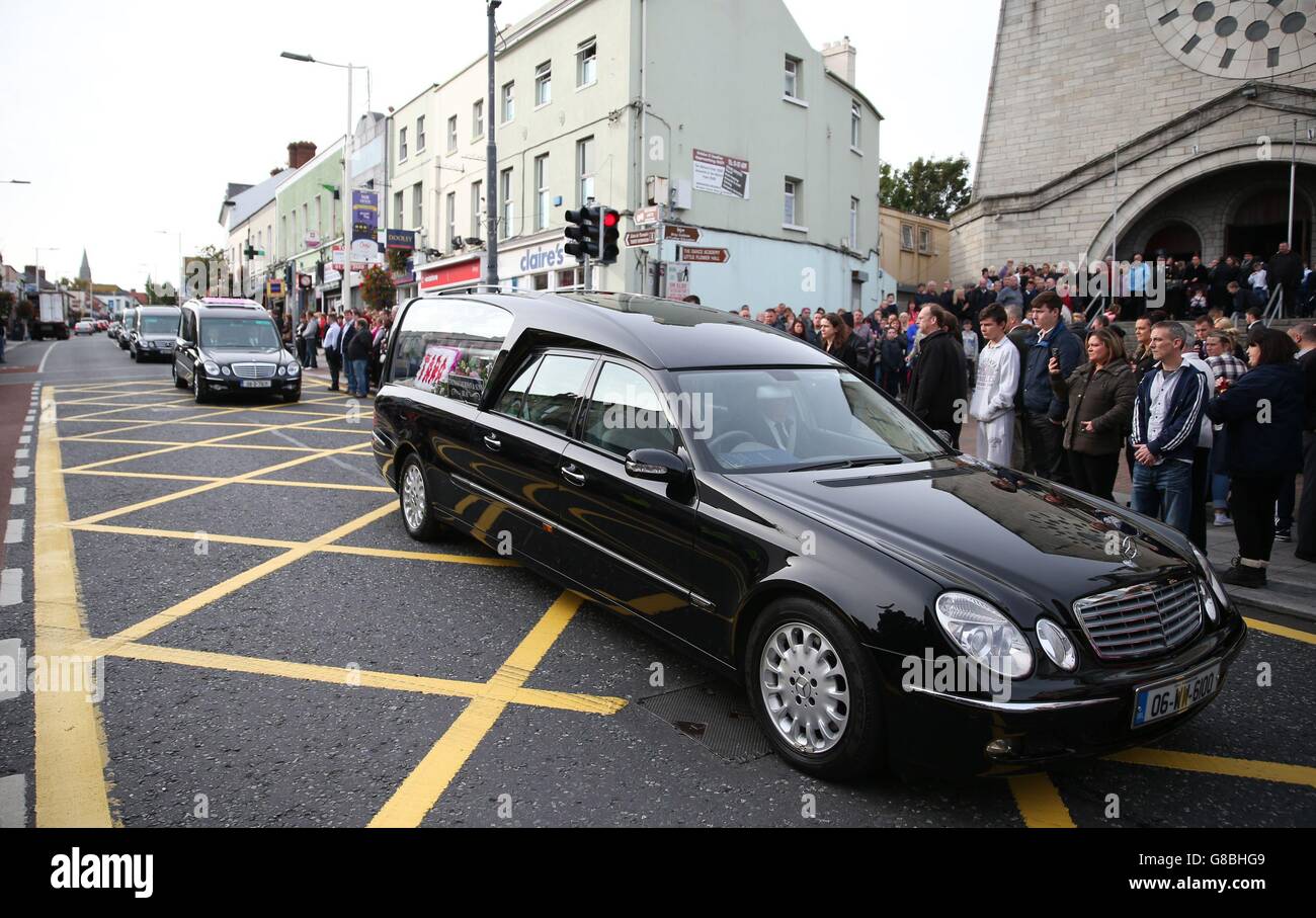 The coffins arrive at the Church of the Holy Redeemer in Bray, Co ...