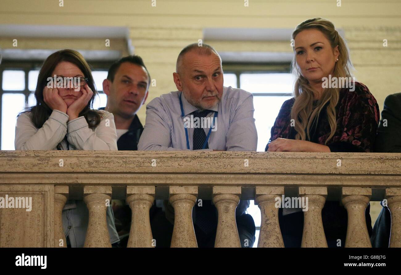 Sinn Fein negotiator Sean (Spike) Murray (centre) listens to ...