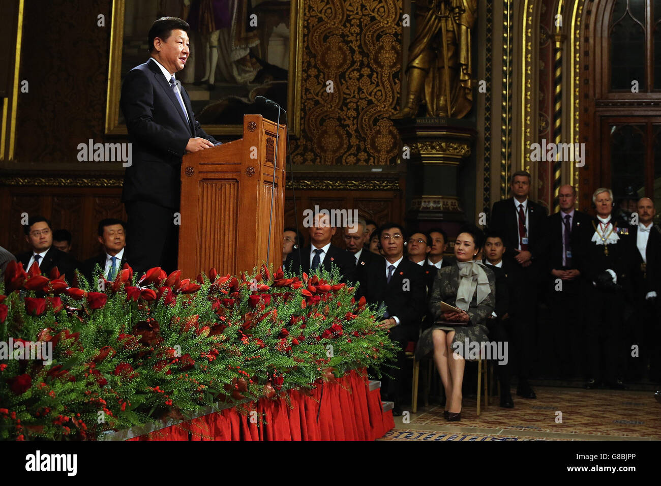 China's First Lady Peng Liyuan listens to China President Xi Jinping ...