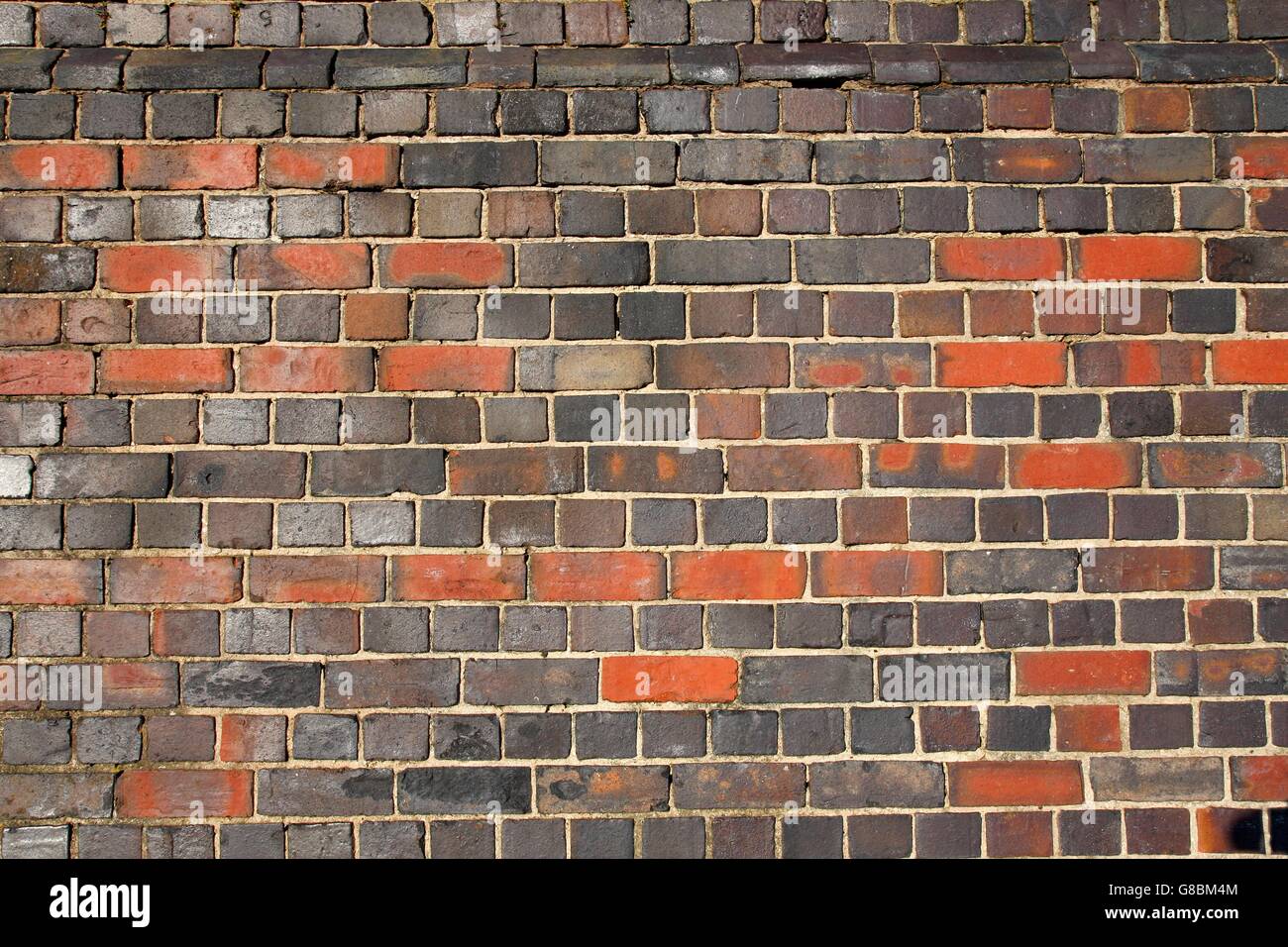 Colourful old weathered brick wall background pattern Stock Photo - Alamy