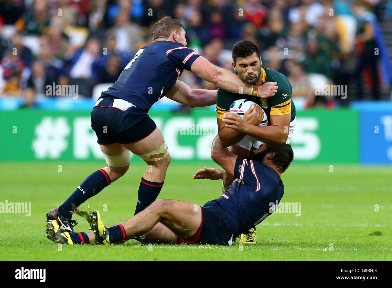 South Africa's Damian De Allende (right) is tackled by USA's Phil Thiel ...