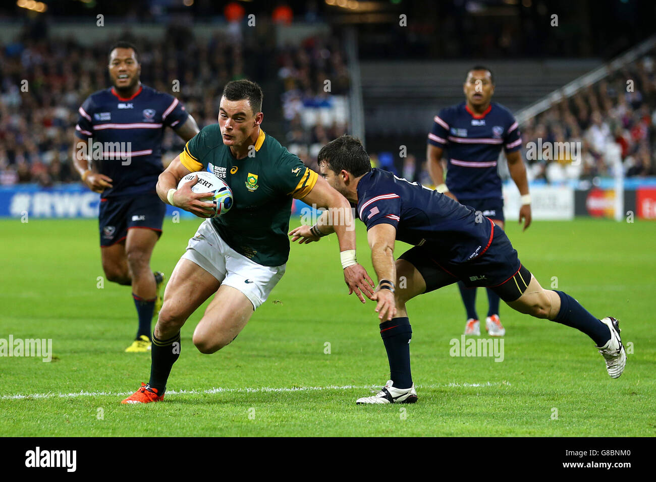 South Africa's Jesse Kriel skips past USA's Niko Kruger (right) to ...