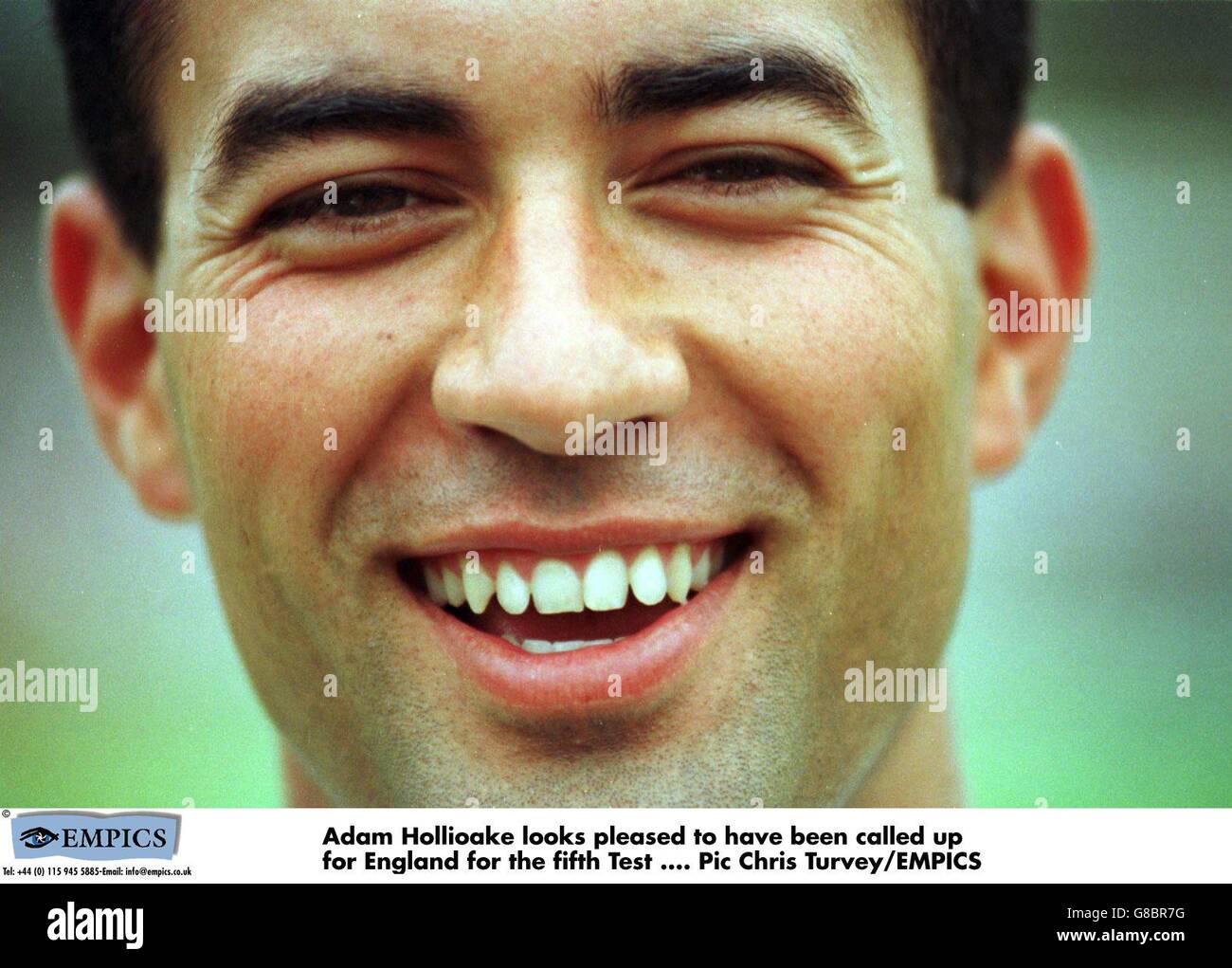 Cricket-England squad announcement. Adam Hollioake looks pleased to ...