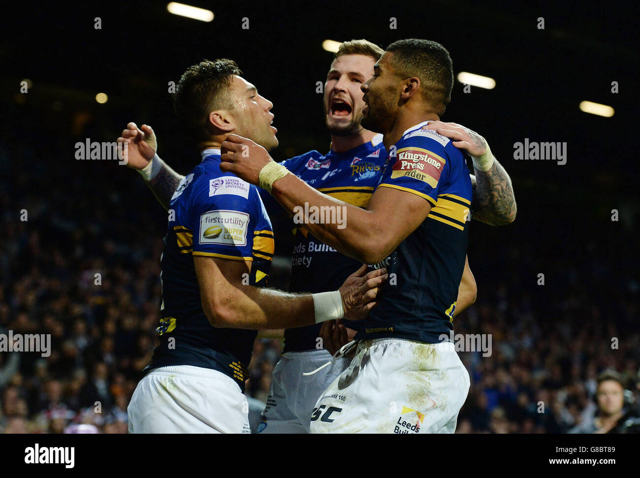 Leeds Rhinos' Joel Moon (left) celebrates with Zac Hardaker and Kallum ...