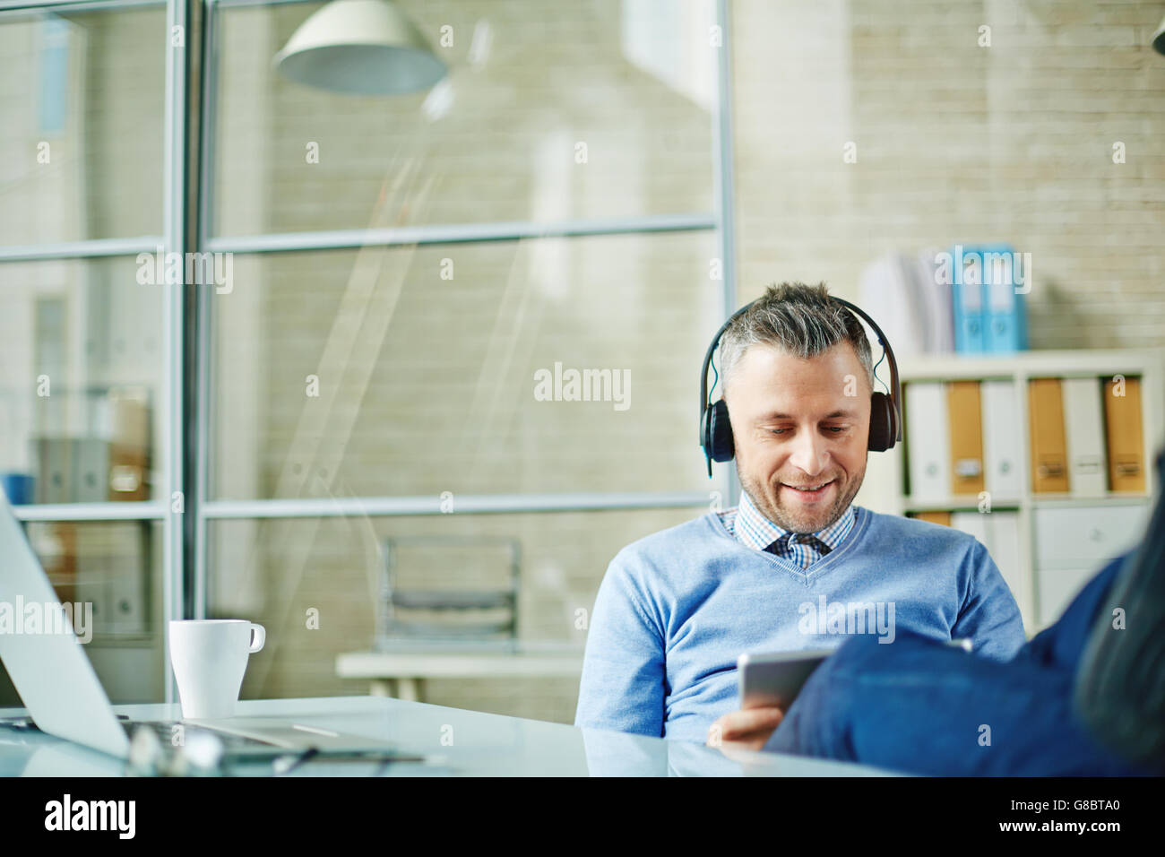 Relaxing at workplace Stock Photo - Alamy