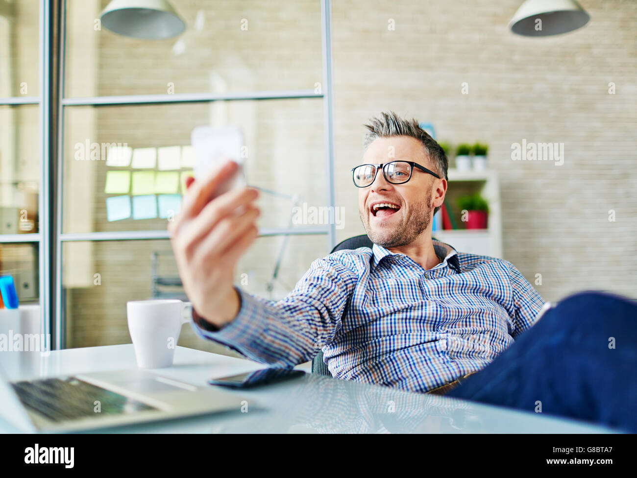 Selfie at workplace Stock Photo - Alamy