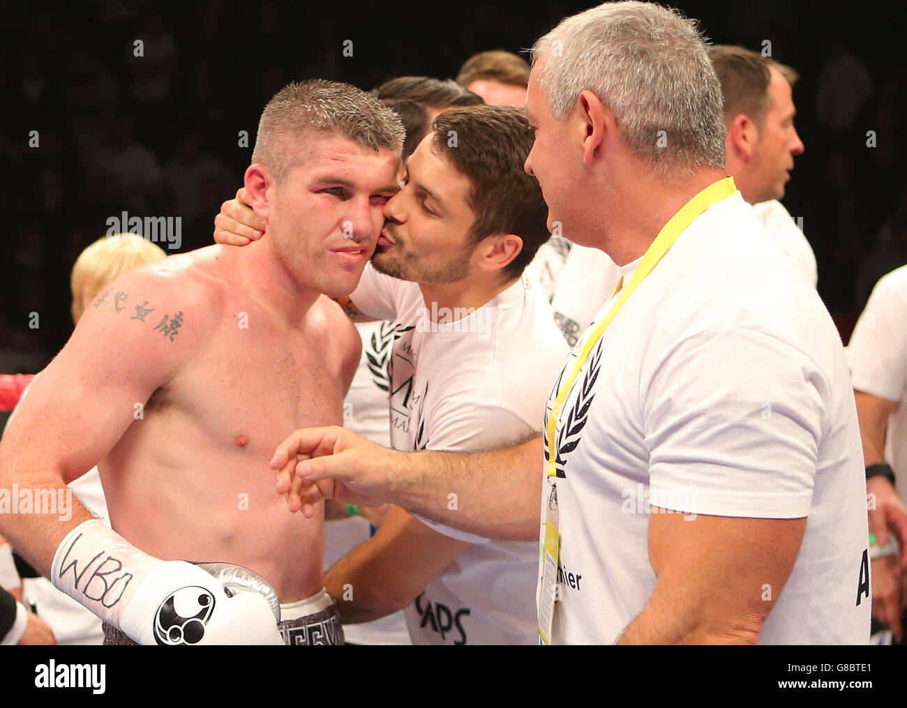 Liam Smith gets a kiss from brother Stephen Smith after beating John ...