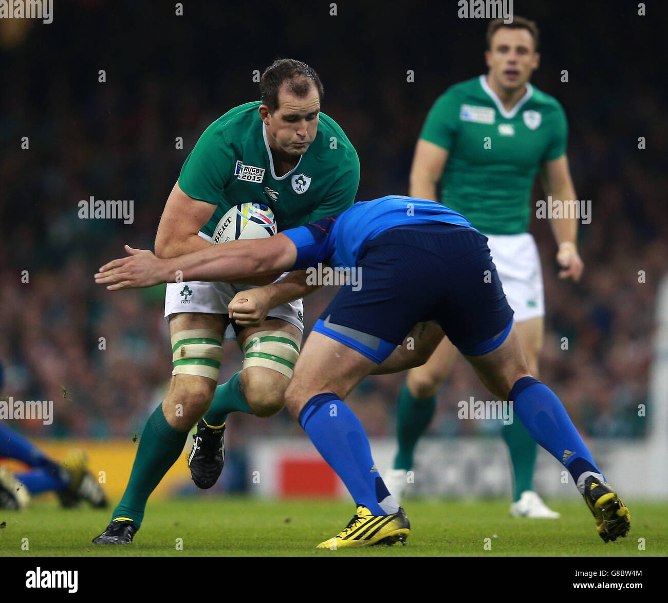 Ireland's Devin Toner (left) is tackled by France's Louis Picamoles ...