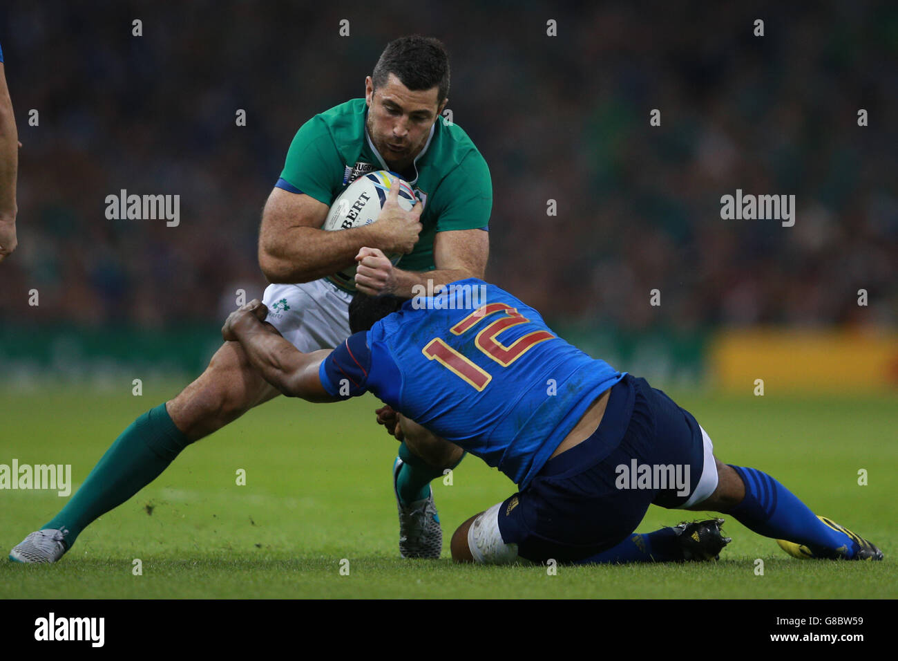 Ireland's Scott Spedding (left) is tackled by France's Wesley Fofana ...
