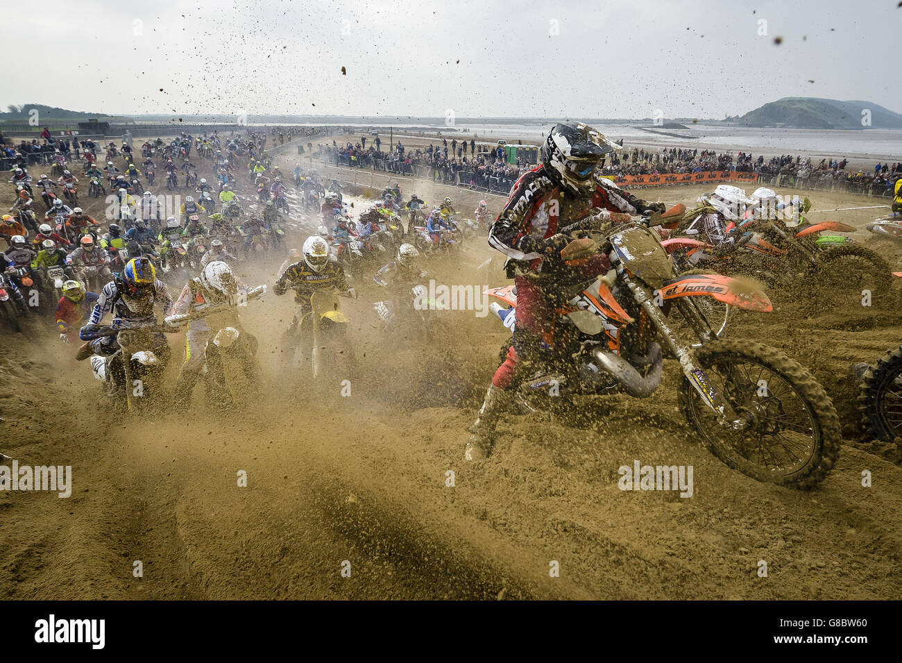 Riders in mens solo race tackle first dune beach race hi-res stock ...