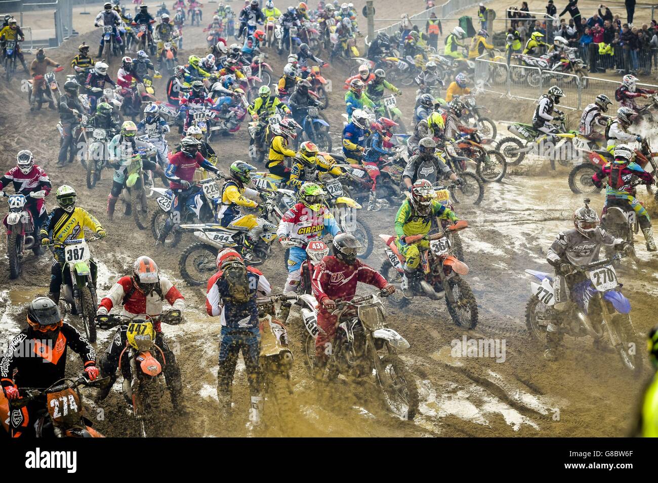 Riders in the men's solo race approach a dune at the Weston Beach Race ...