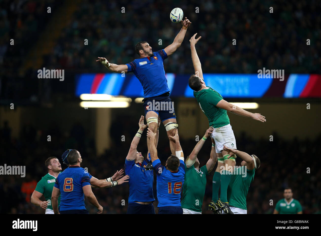 France's Yoann Maestri (left) and Ireland's Devin Toner (right) compete ...