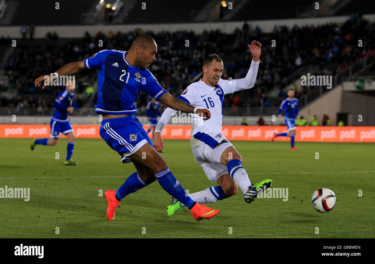 Finland's Sakari Mattila (right) battles for possession of the ball ...