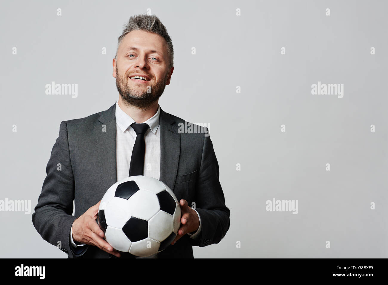Happy businessman soccer ball hi-res stock photography and images - Alamy