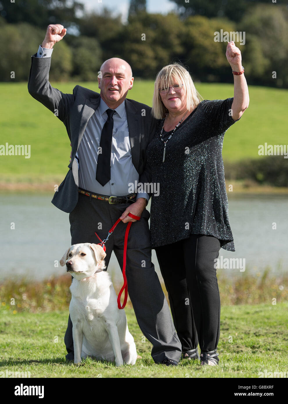 Alan (left) and Jane Slater celebrate with their 2 year old Labrador ...