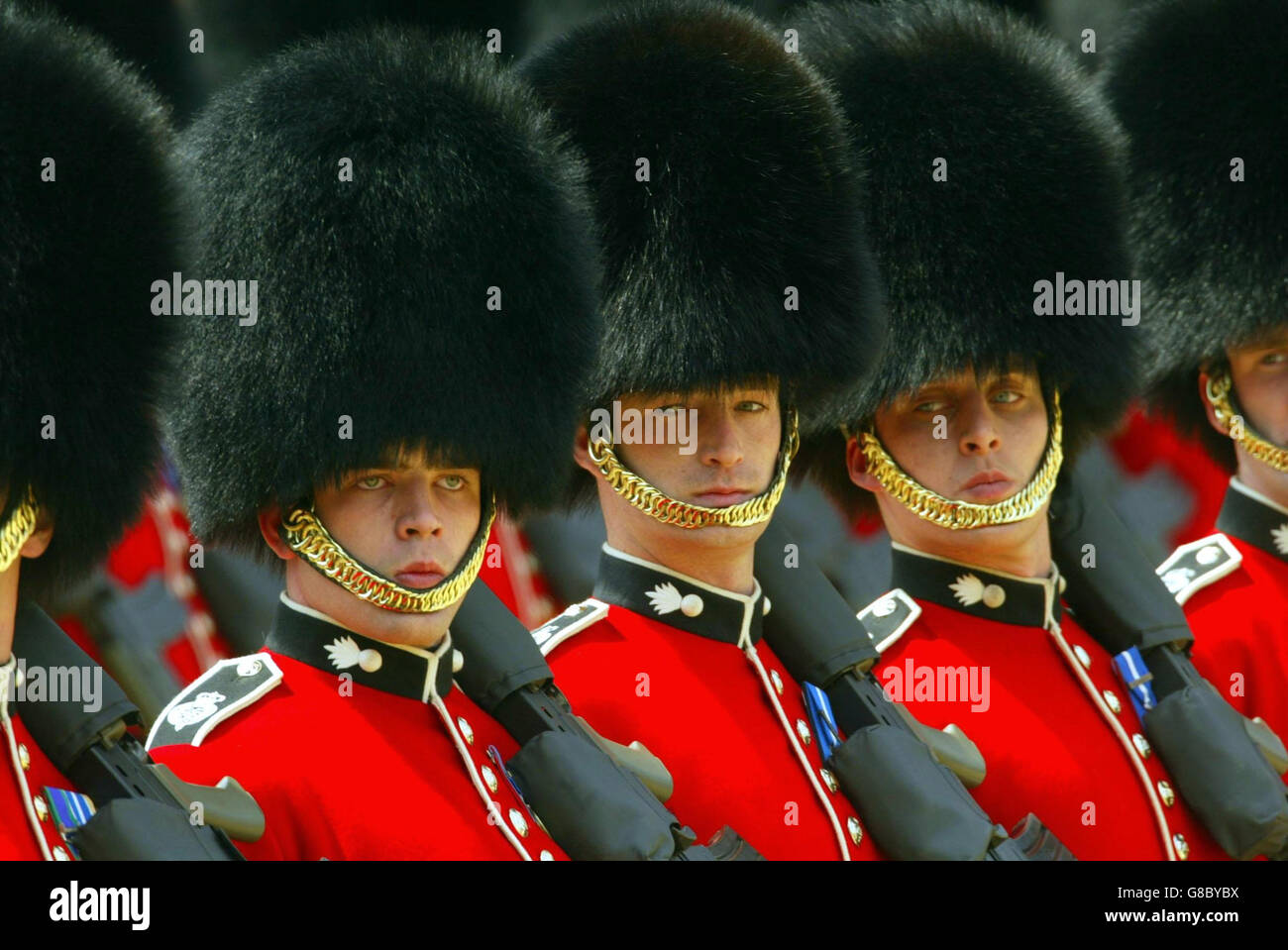 Troops march past Queen Elizabeth II Stock Photo - Alamy