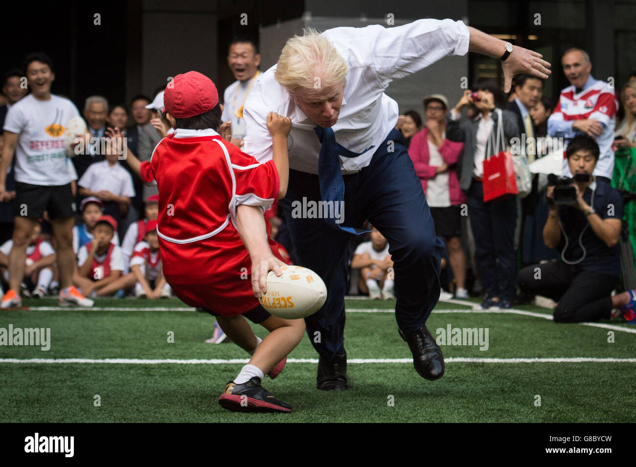 Mayor of London Boris Johnson joins a Street Rugby tournament in a ...