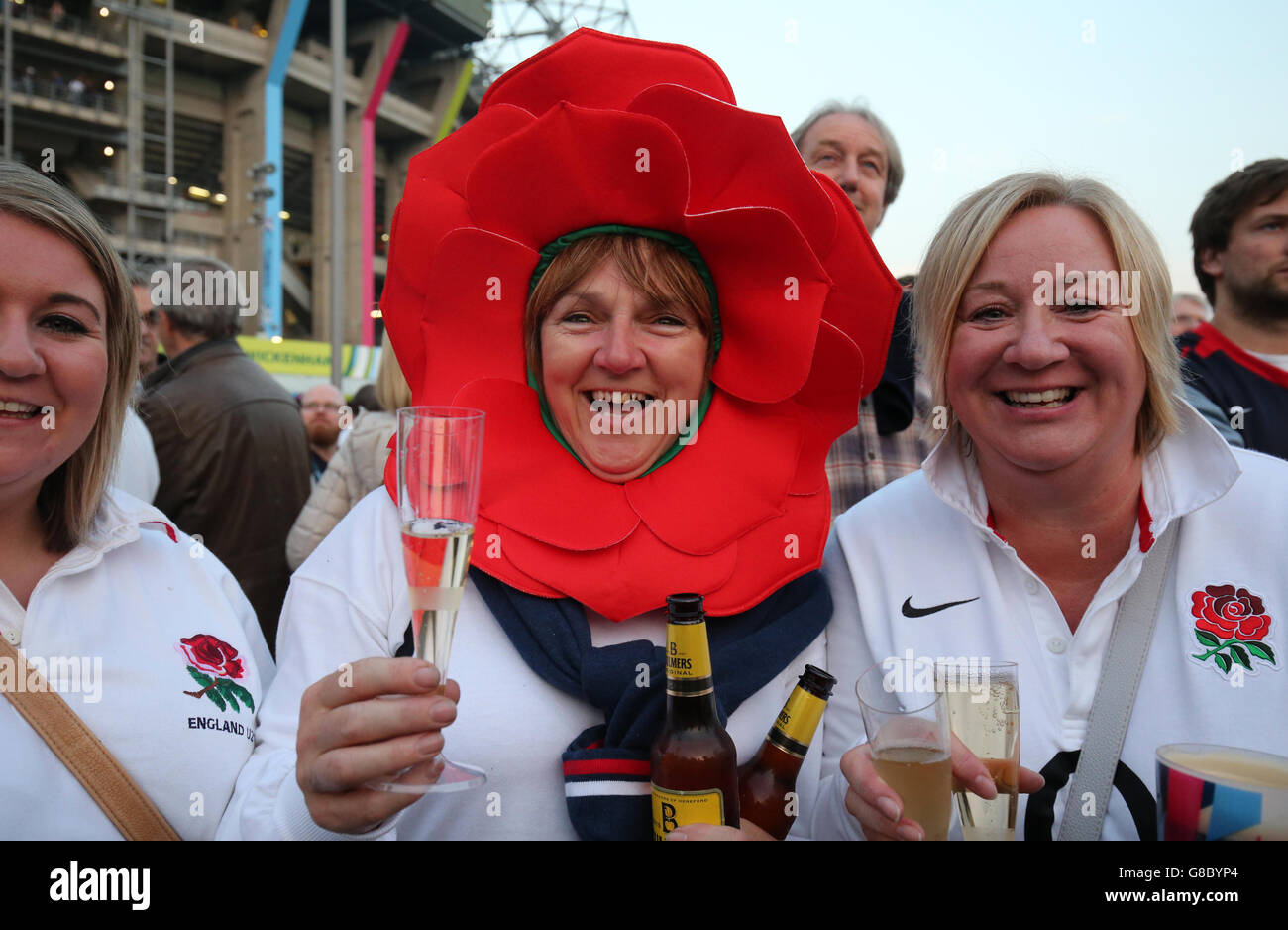 A England fan wearing a rose hat outside Twickenham before the match ...