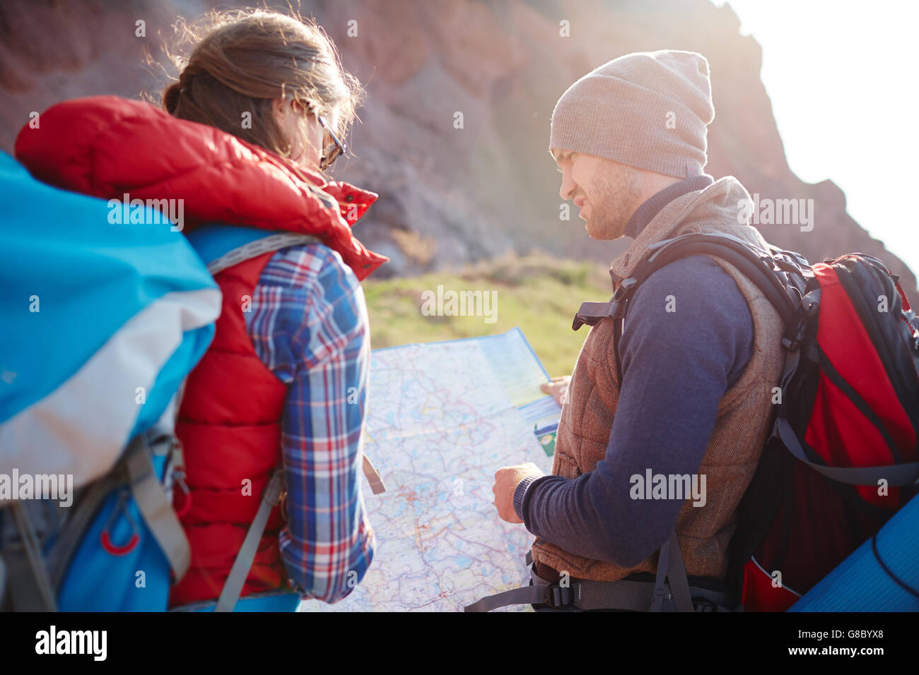 Tourists with map Stock Photo - Alamy