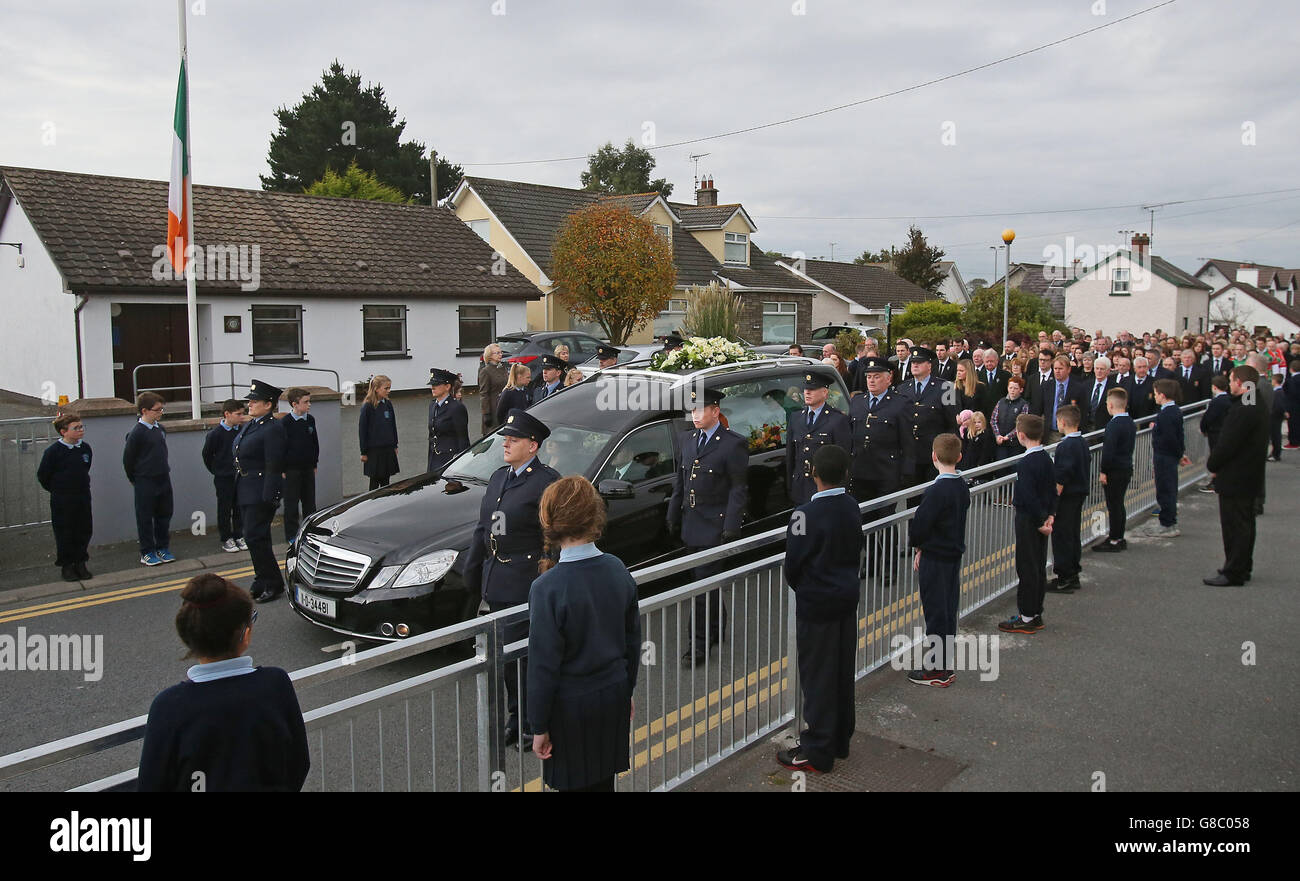 The funeral cortege of Garda Tony Golden passes Blackrock Garda station ...