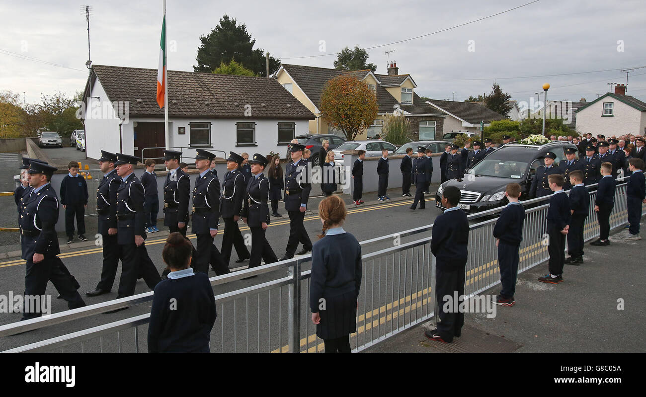 The funeral cortege of Garda Tony Golden passes Blackrock Garda station ...