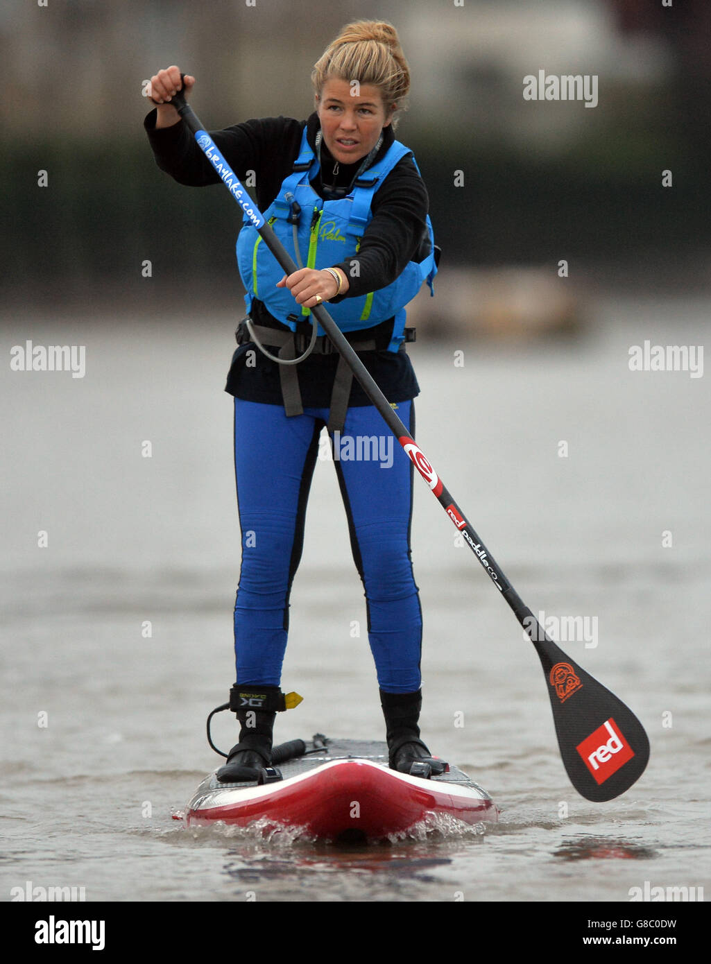 Amber Nuttall navigates her paddle board through central London as she ...