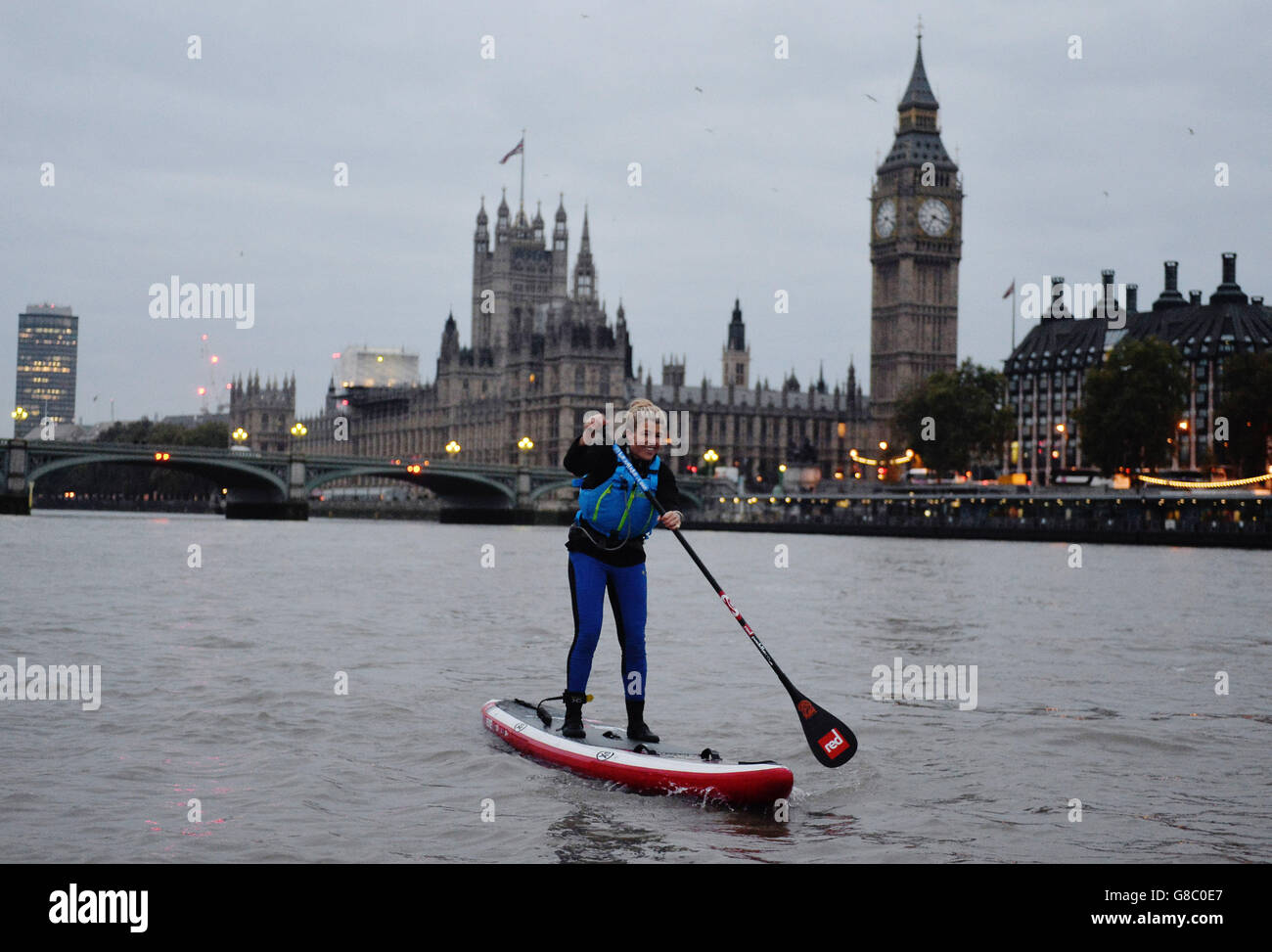 Amber Nuttall navigates her paddle board through central London near ...