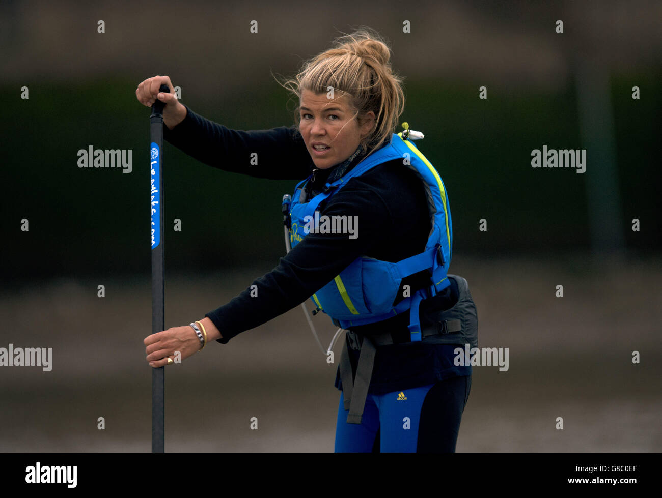Amber Nuttall navigates her paddle board through central London as she ...