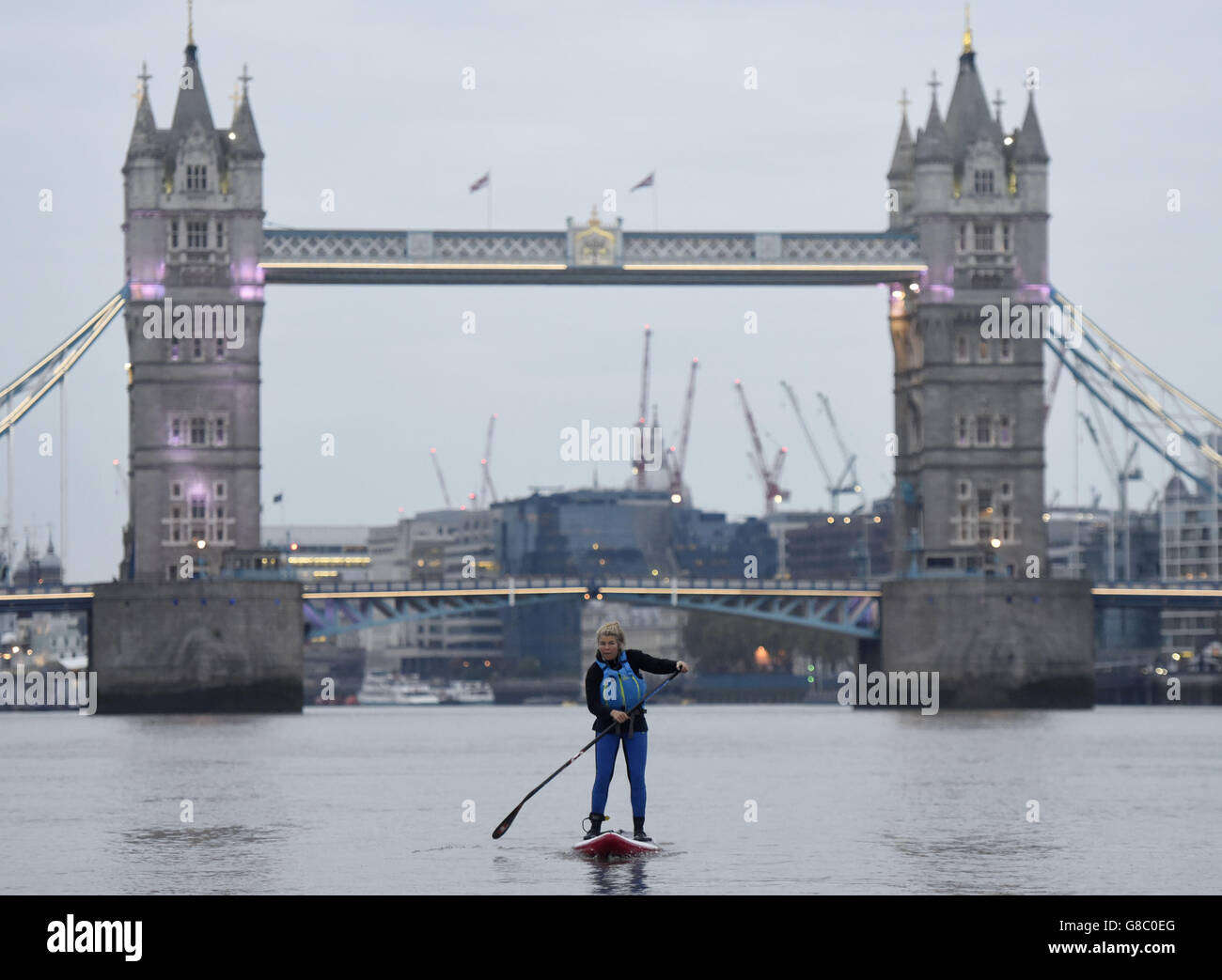 Amber Nuttall navigates her paddle board through central London near ...