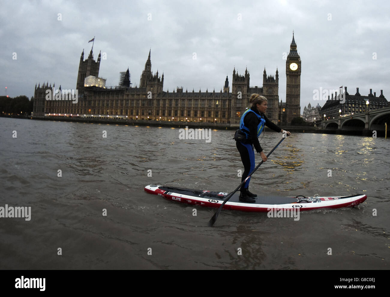 Amber Nuttall navigates her paddle board through central London near ...
