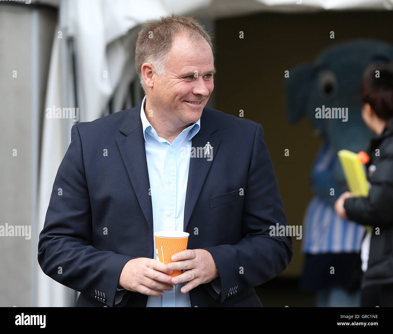 Blackpool's manager Neil McDonald looks happy during the game against ...