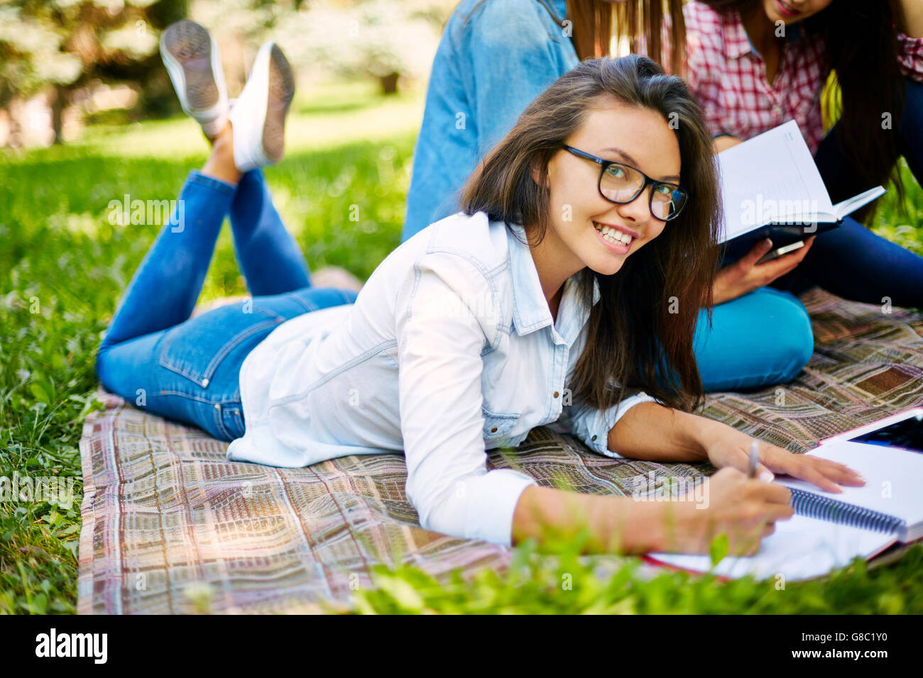 Girl making notes Stock Photo - Alamy