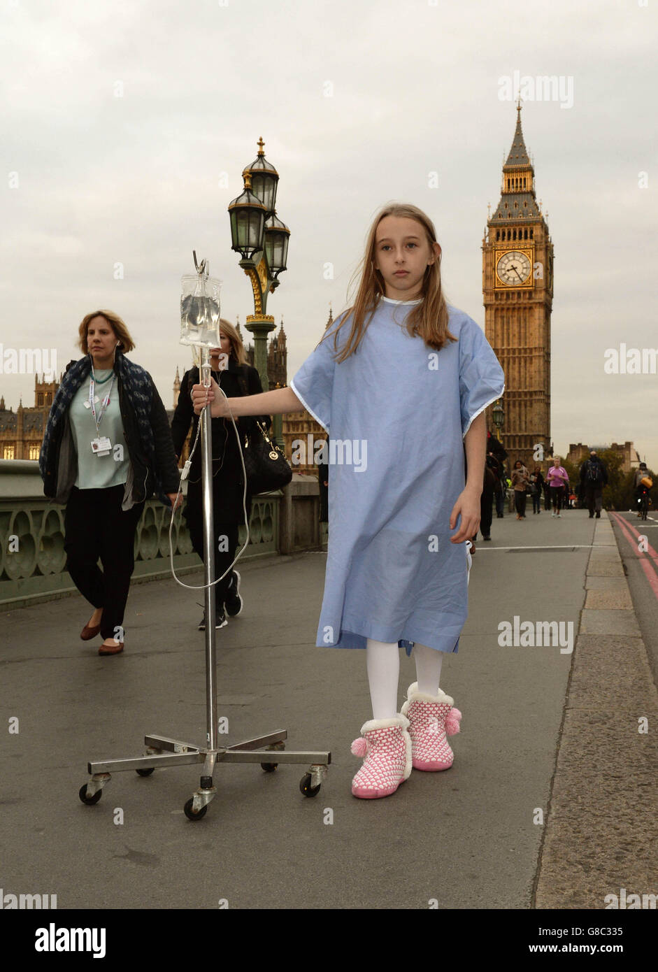 Ellie Townsend, aged 10 from Reading, dressed in a surgical gown and ...