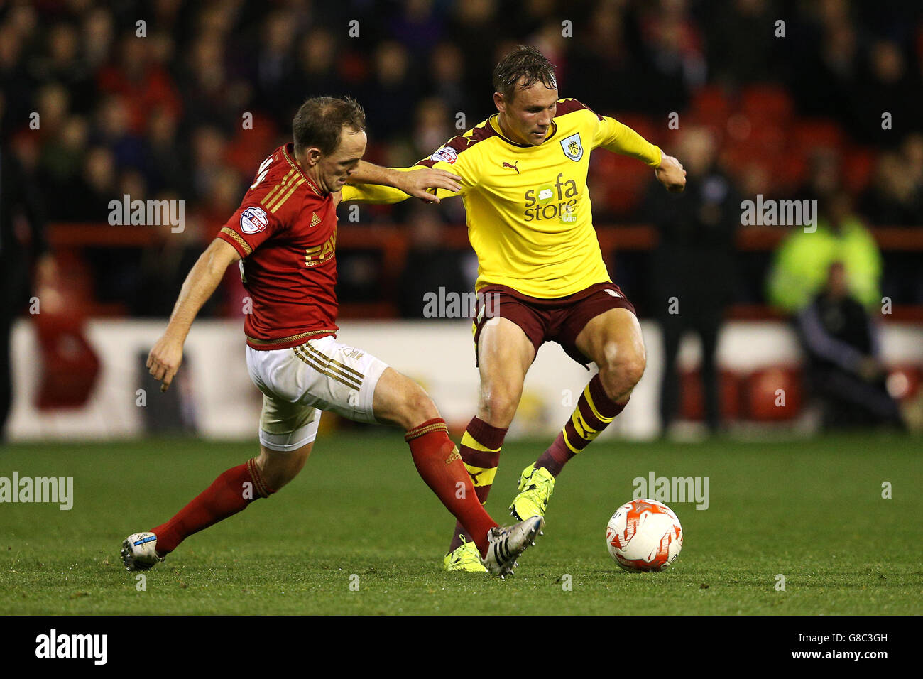 Burnleys matthew taylor right takes on nottingham forests david vaughan ...