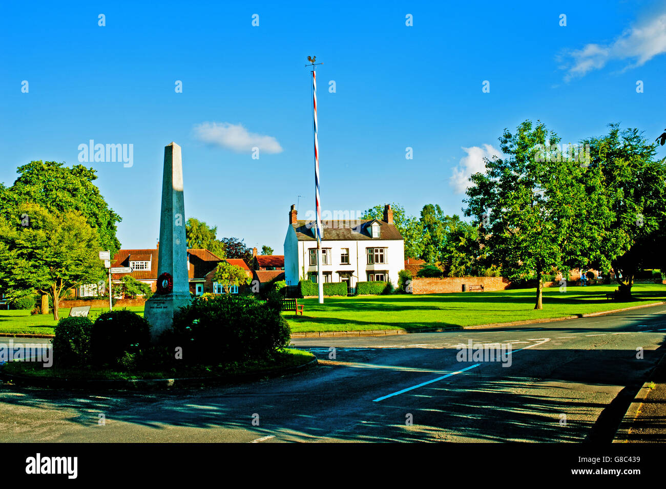 War Memorial and Village Green, Upper Poppleton, Yorkshire Stock Photo ...