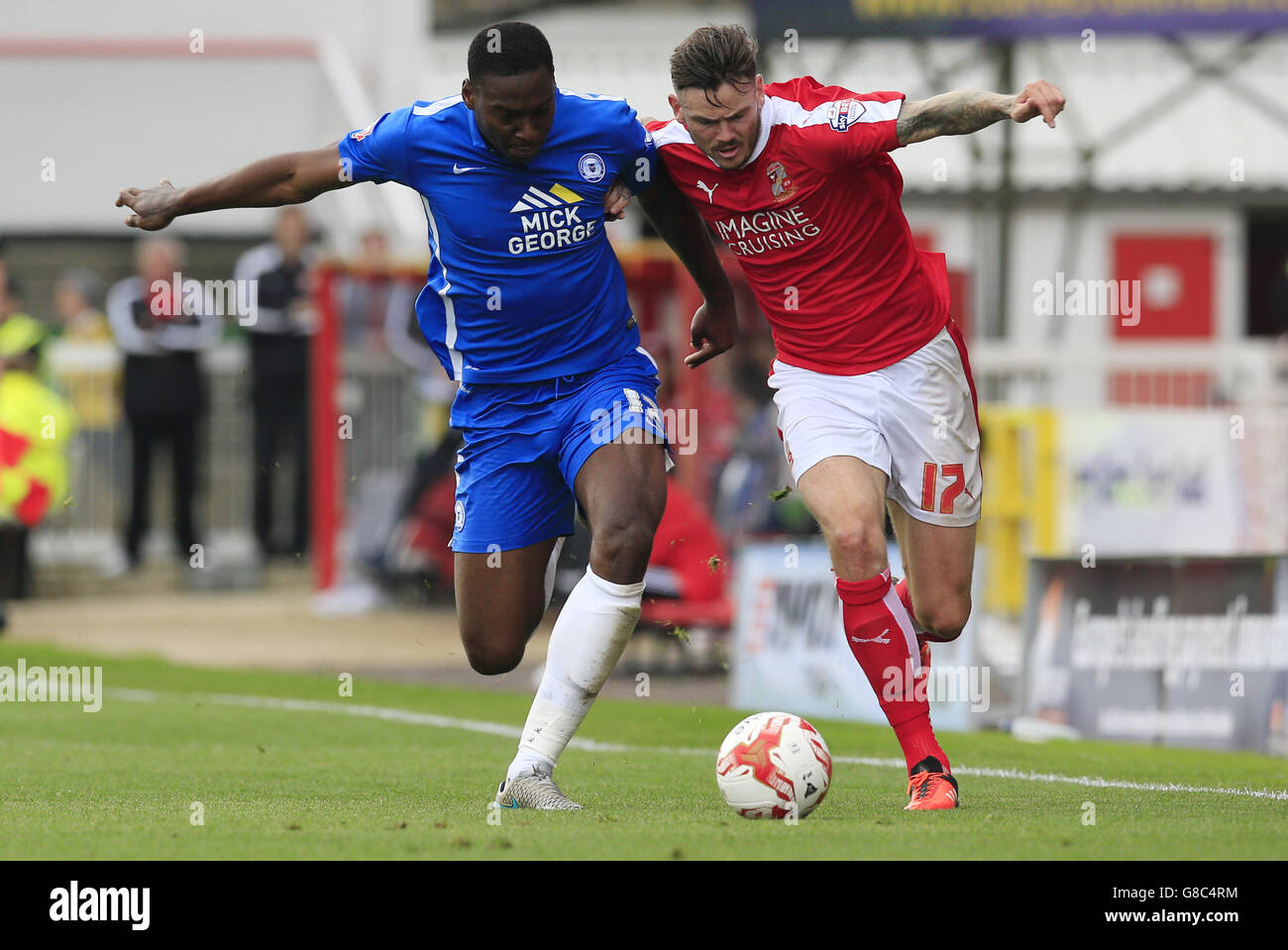 Peterborough United's Ricardo Almeida Santos (left) and Swindon Town's ...