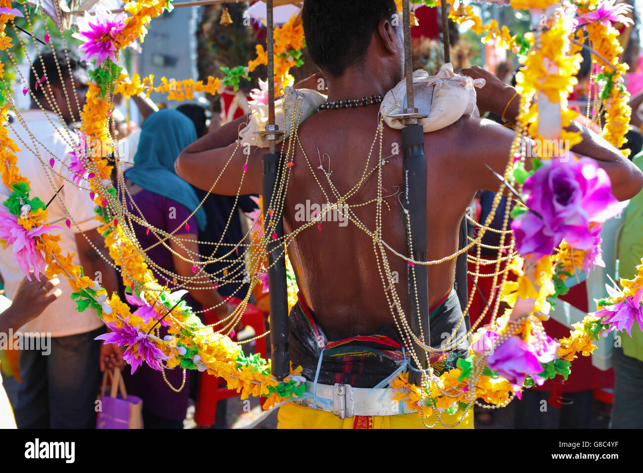 Hindu man carrying beautifully decorated kavadi at Batu Cave temple ...