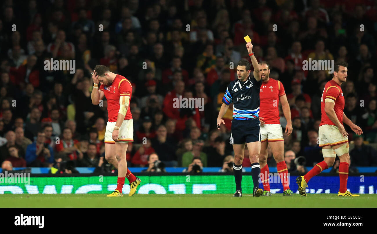 Wales' Alex Cuthbert (left) walks off the pitch dejected as he is shown ...