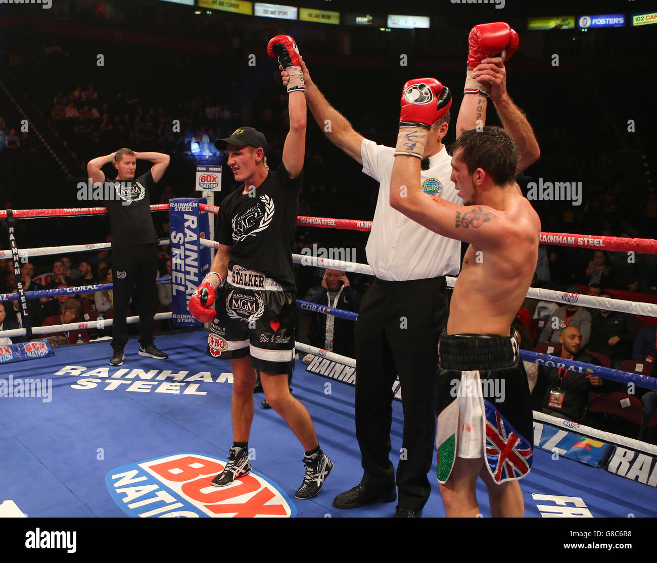 Thomas Stalker (left) and Craig Evans have their arms raised as a draw ...