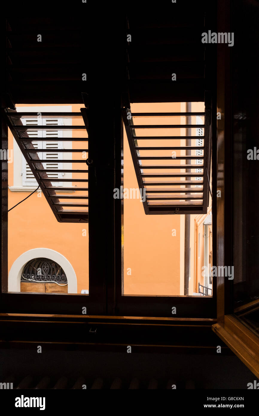 Window shutters propped open in a hotel room in La Felicina, San Piero ...