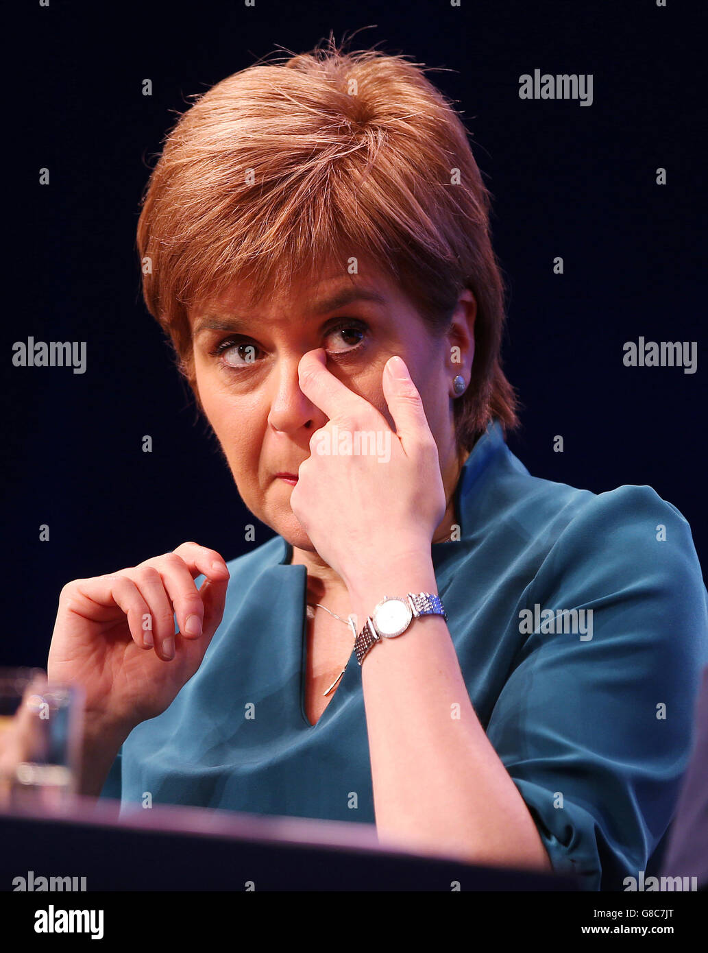 SNP leader Nicola Sturgeon listens as deputy SNP leader Stewart Hosie ...