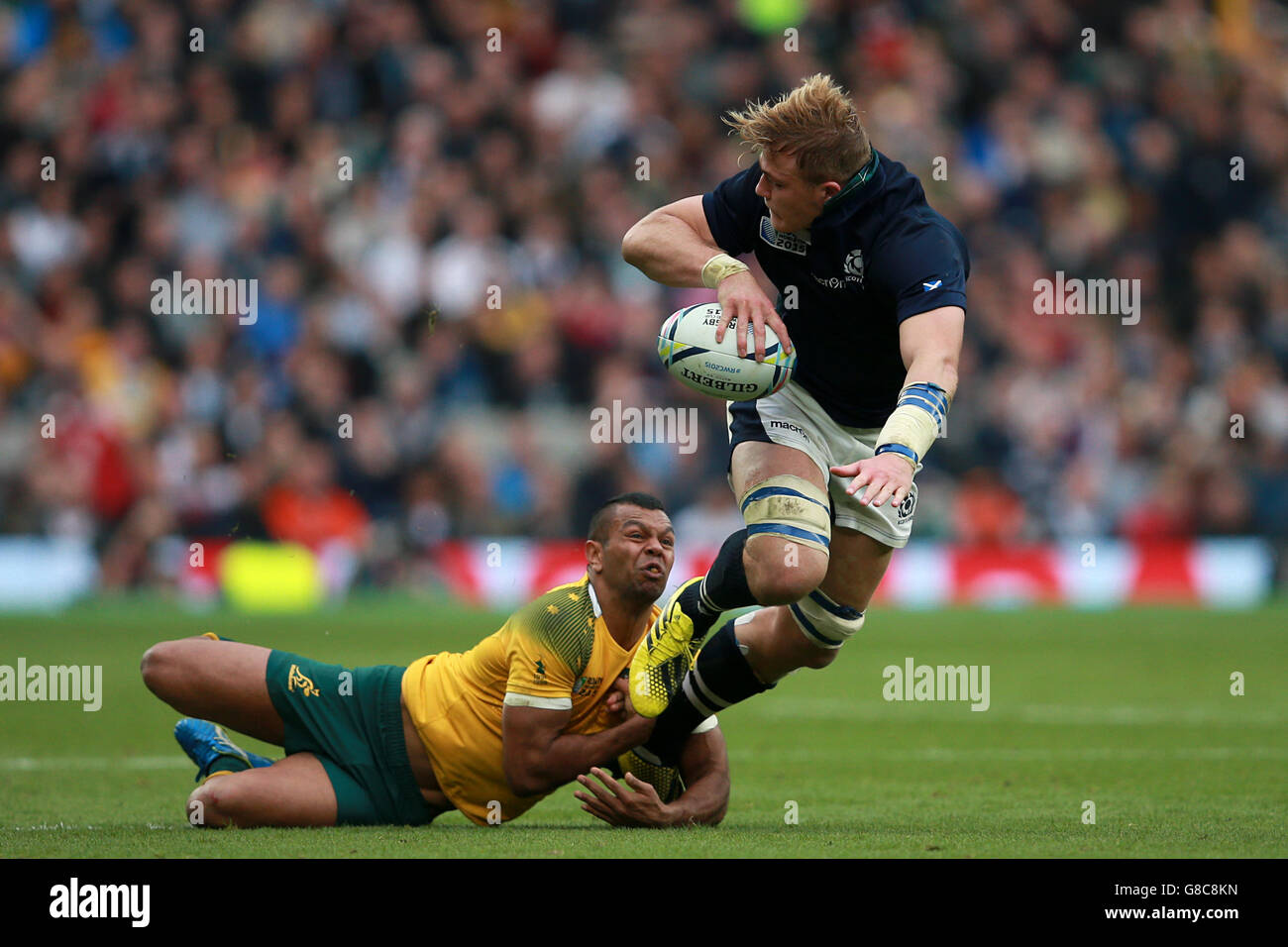 Scotland's David Denton (right) evades the challenge of Australia's ...